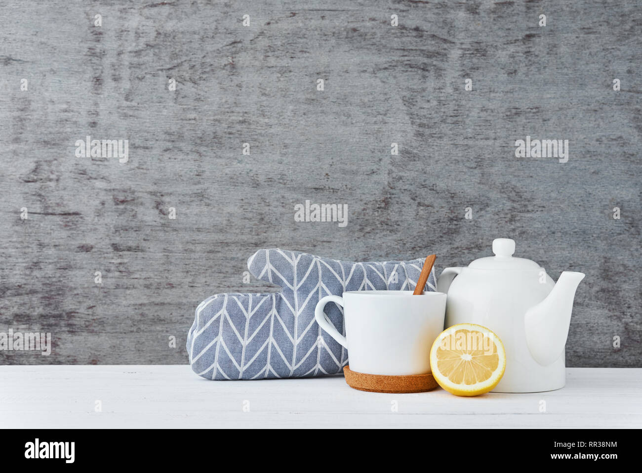 Ceramic teapot, white cup and lemon on wooden background Stock Photo ...