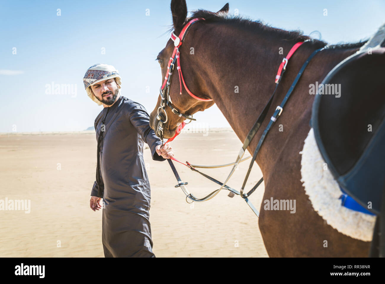 Arab man walk horse hi-res stock photography and images - Alamy