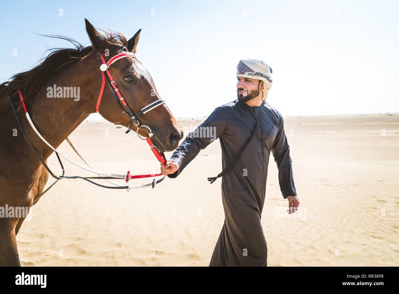 Arab man walk horse hi-res stock photography and images - Alamy