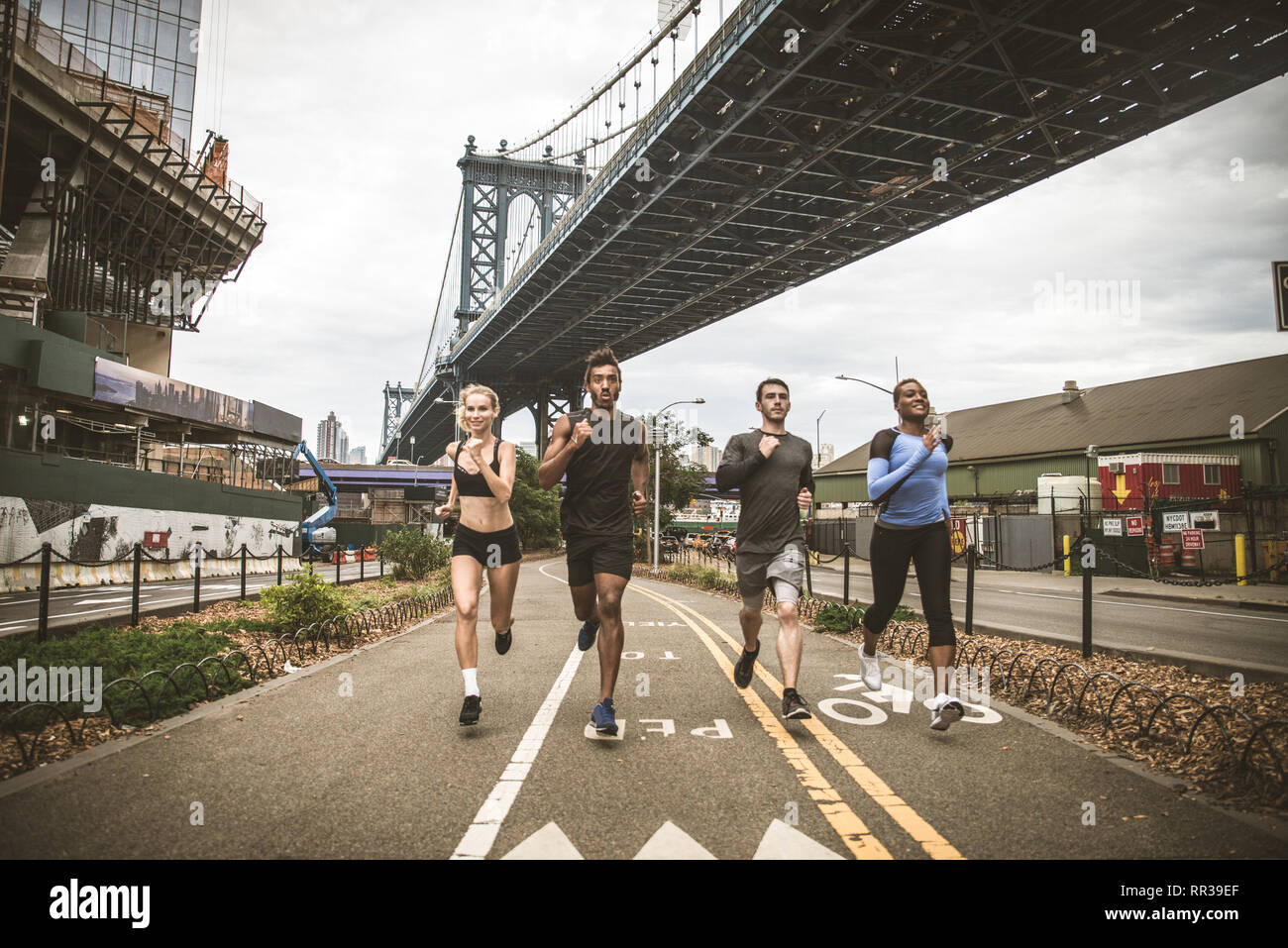 Multi-ethnic group of runners training outdoors - Sportive people ...