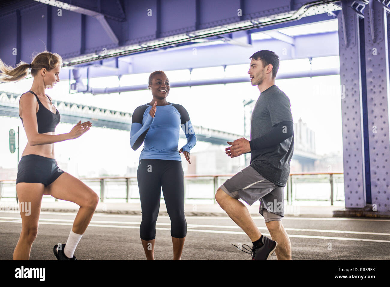 Multi-ethnic group of runners training outdoors - Sportive people ...