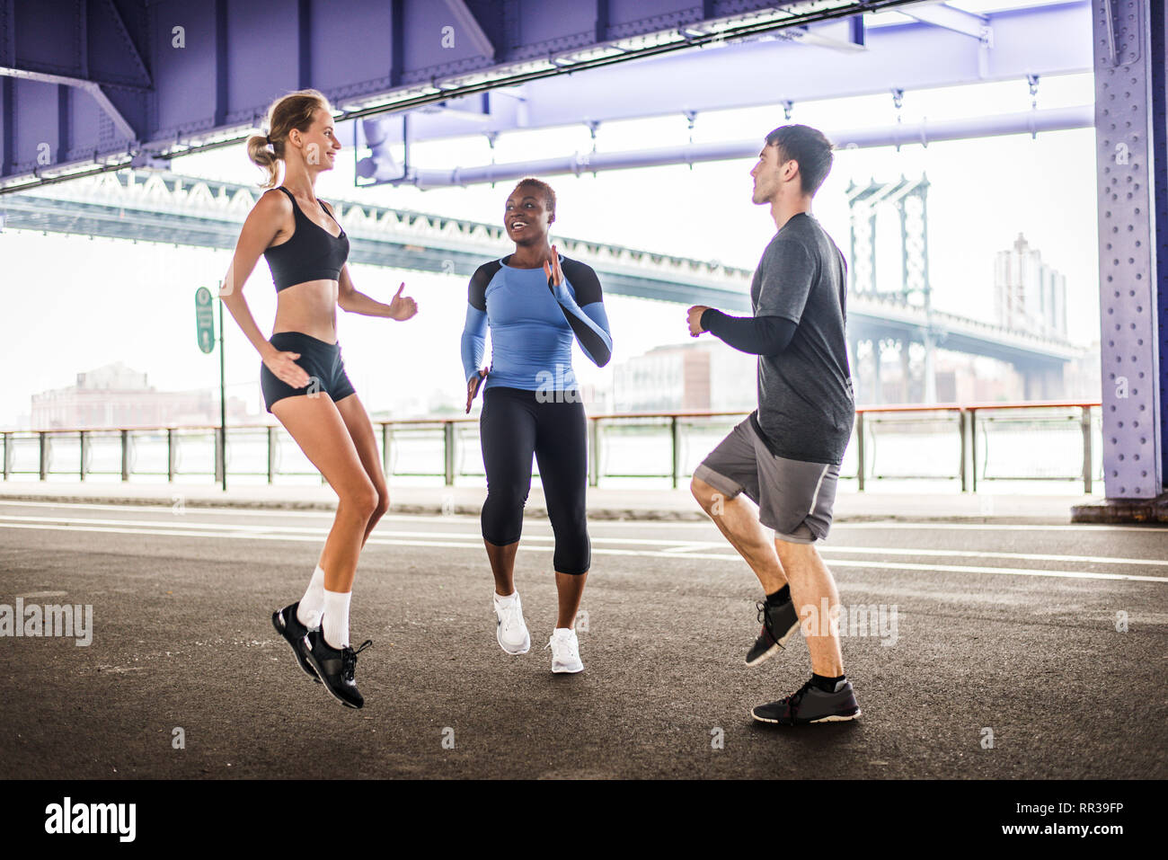 Multi-ethnic group of runners training outdoors - Sportive people ...