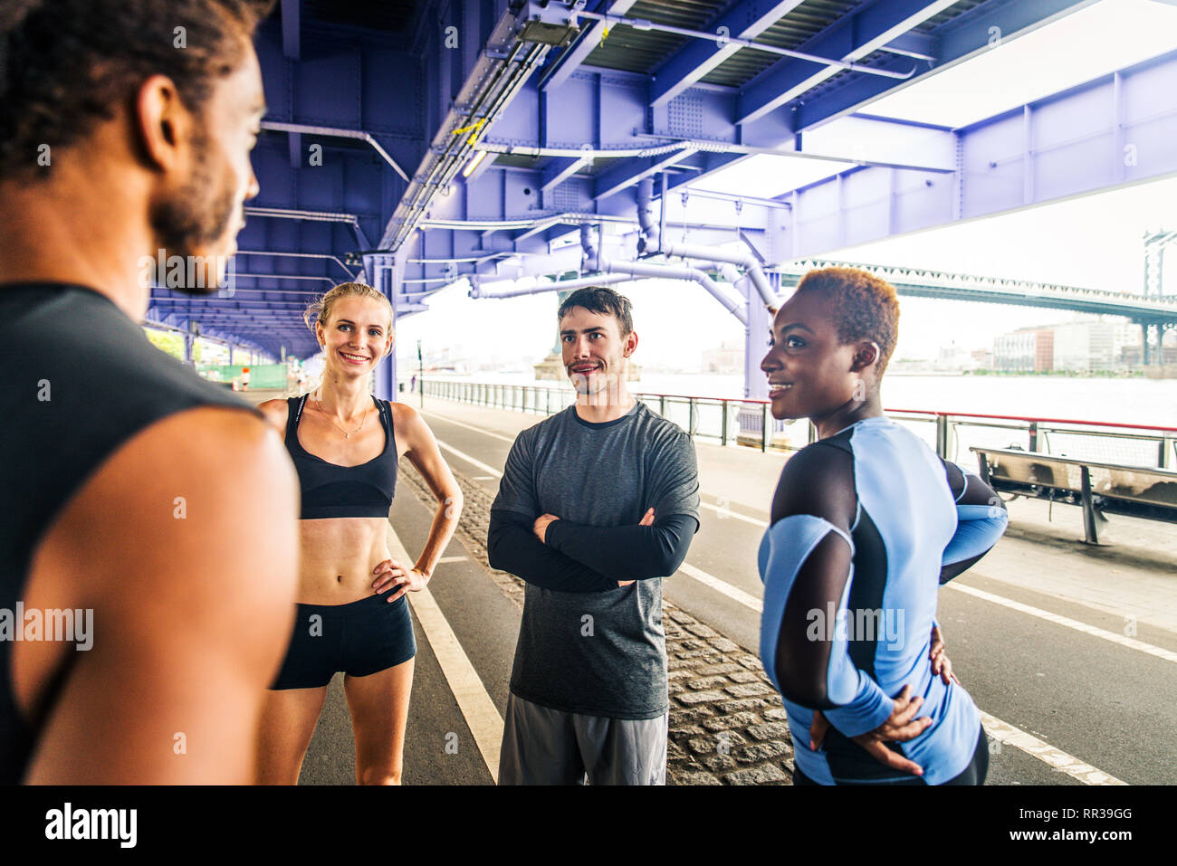 Multi-ethnic group of runners training outdoors - Sportive people ...
