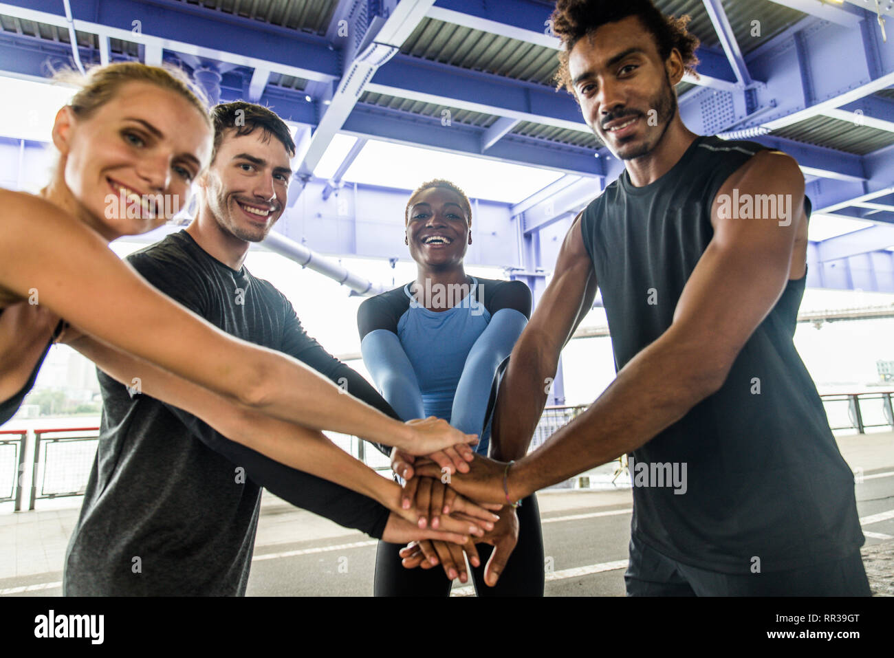 Multi-ethnic group of runners training outdoors - Sportive people ...
