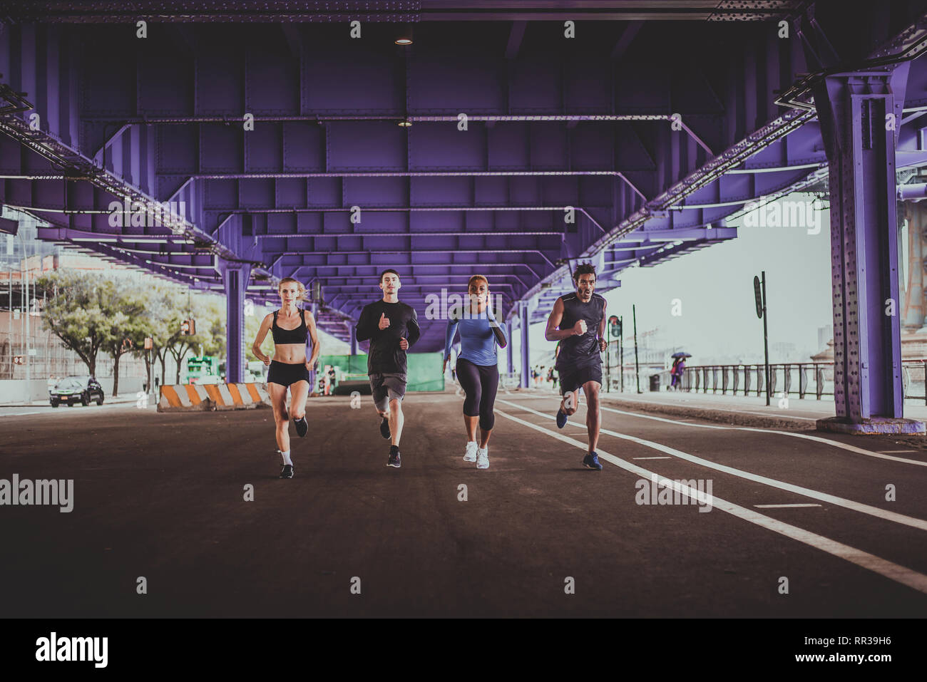 Multi-ethnic group of runners training outdoors - Sportive people ...