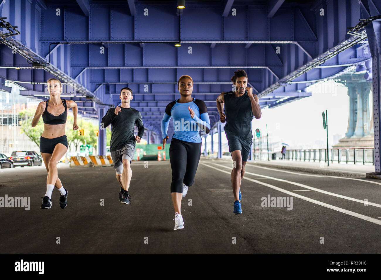 Multi-ethnic group of runners training outdoors - Sportive people ...