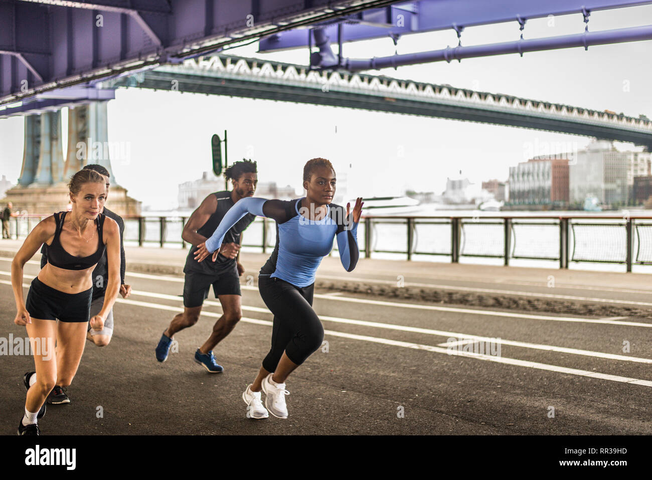 Multi-ethnic group of runners training outdoors - Sportive people ...