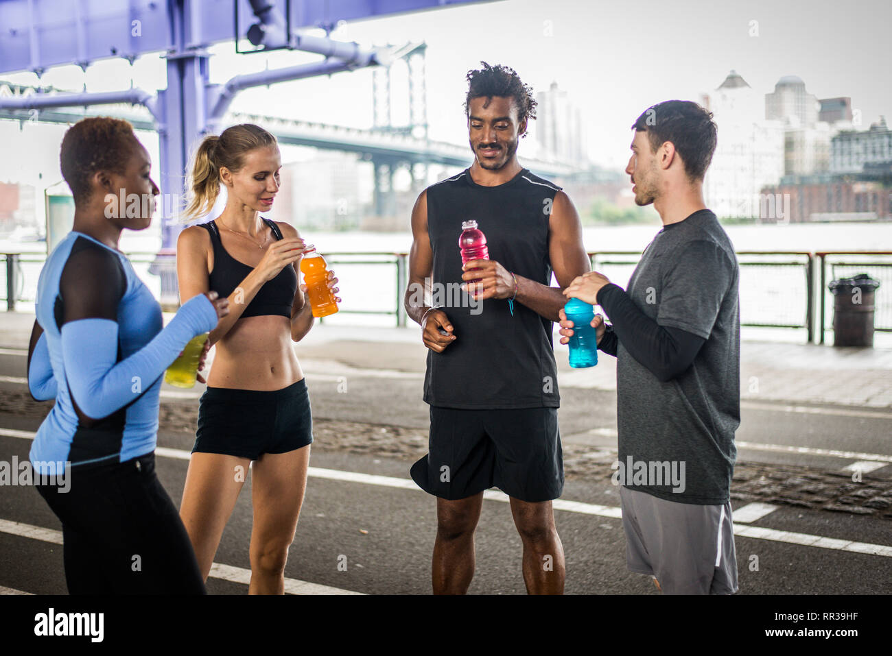 Multi-ethnic group of runners training outdoors - Sportive people ...