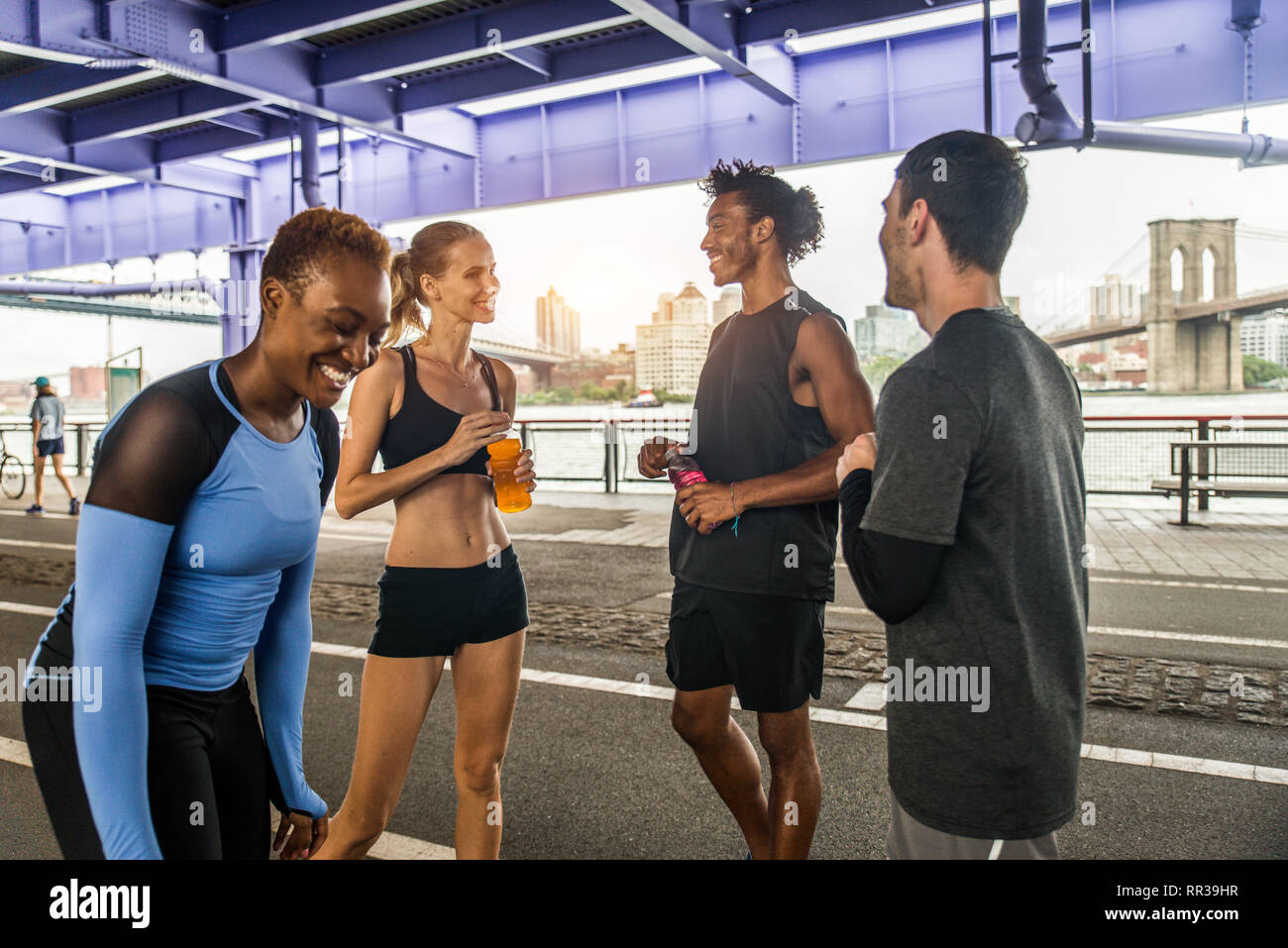 Multi-ethnic group of runners training outdoors - Sportive people ...