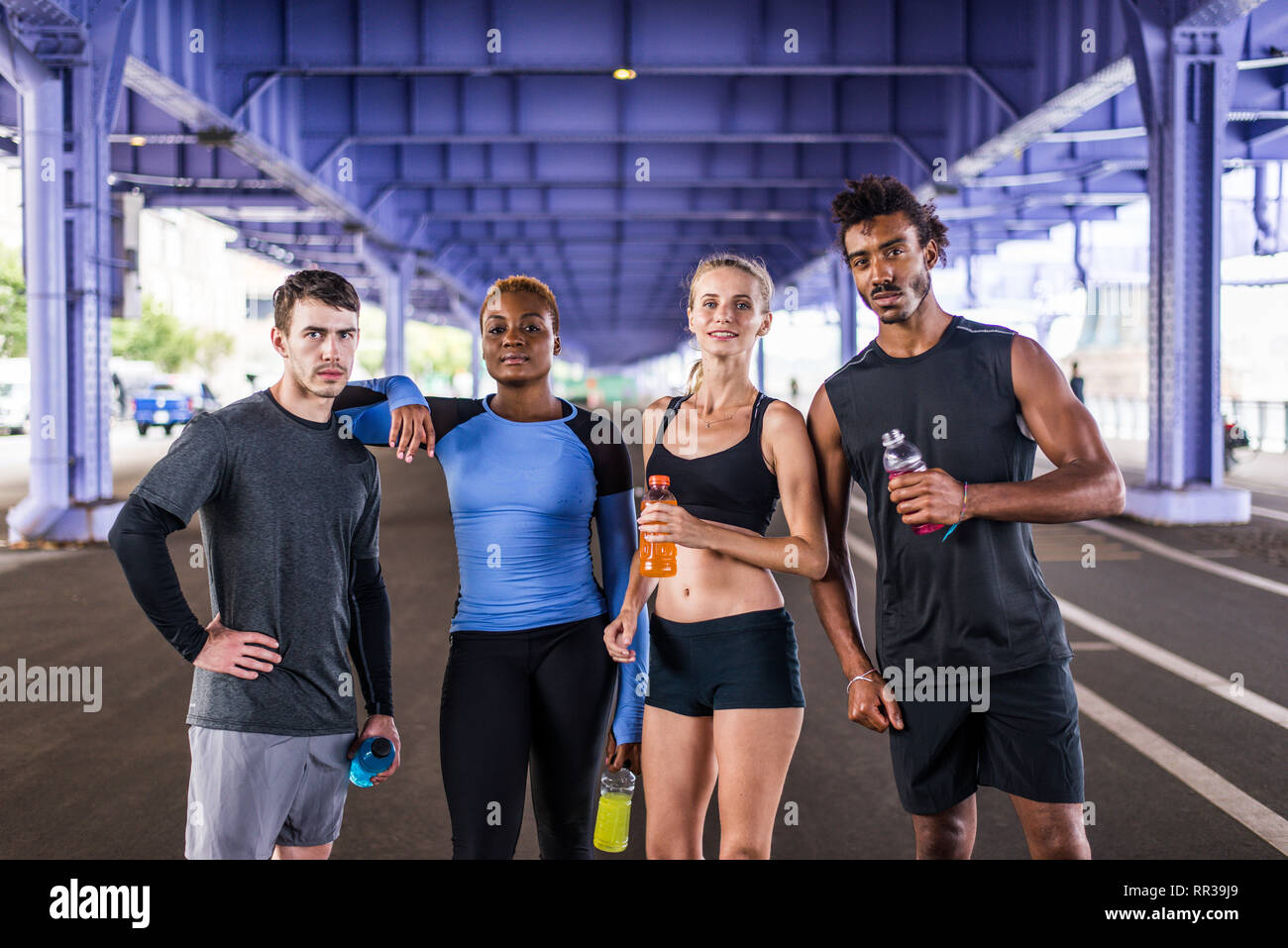 Multi-ethnic group of runners training outdoors - Sportive people ...