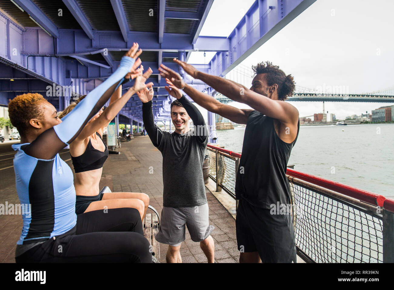 Multi-ethnic group of runners training outdoors - Sportive people ...