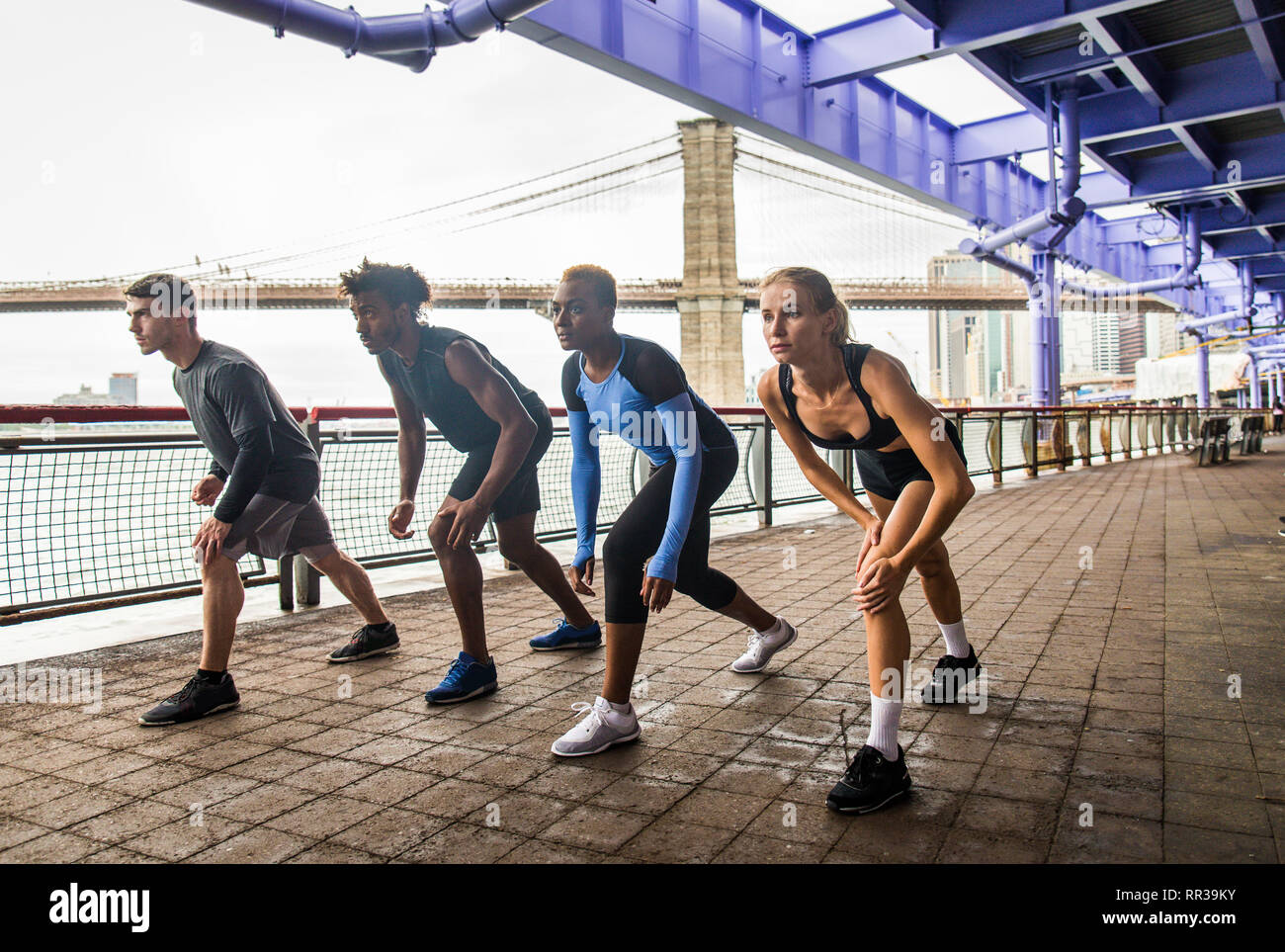 Multi-ethnic group of runners training outdoors - Sportive people ...
