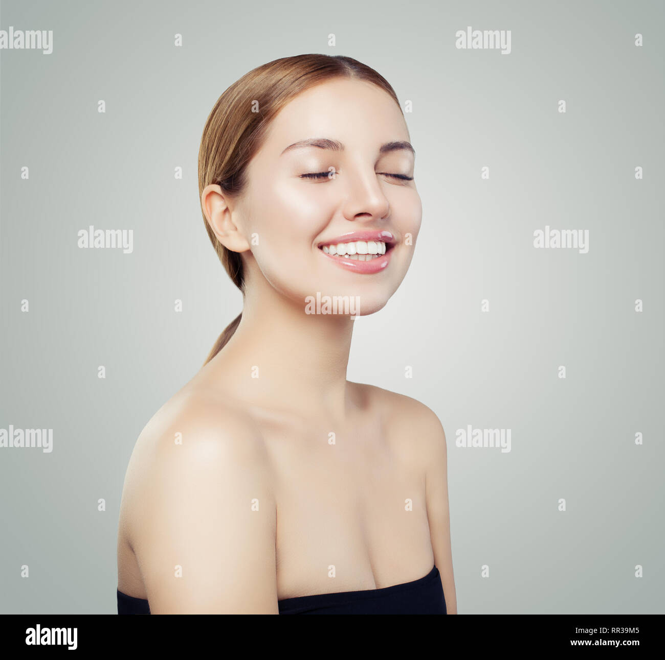 Pretty smiling woman portrait. Beautiful girl face with clear skin ...