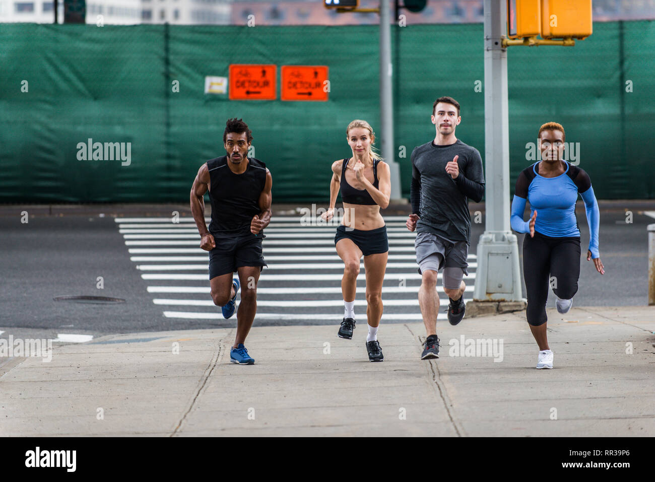 Multi-ethnic group of runners training outdoors - Sportive people ...