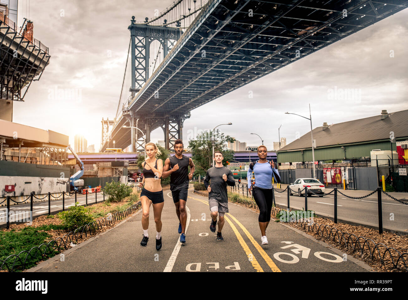 Multi-ethnic group of runners training outdoors - Sportive people ...