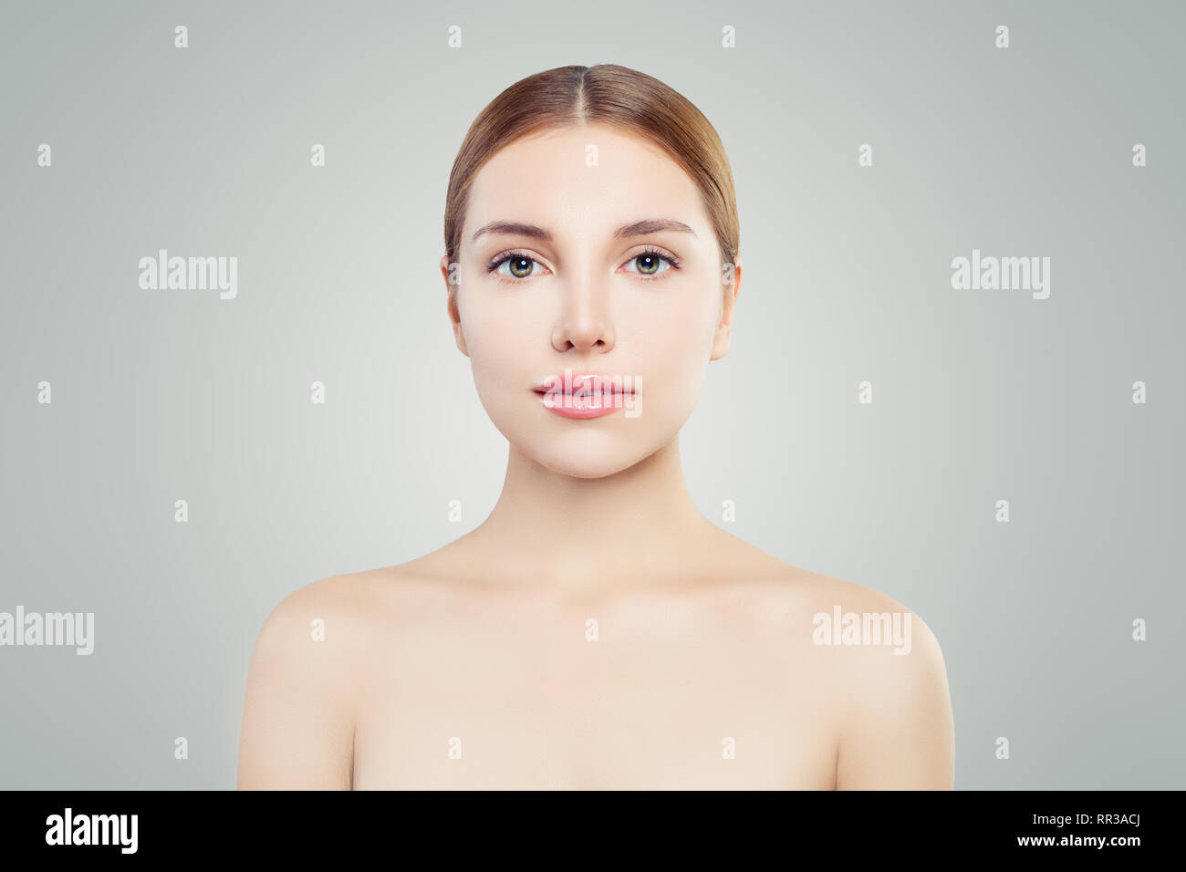 Perfect face. Young woman with clear skin. Pretty girl looking at ...