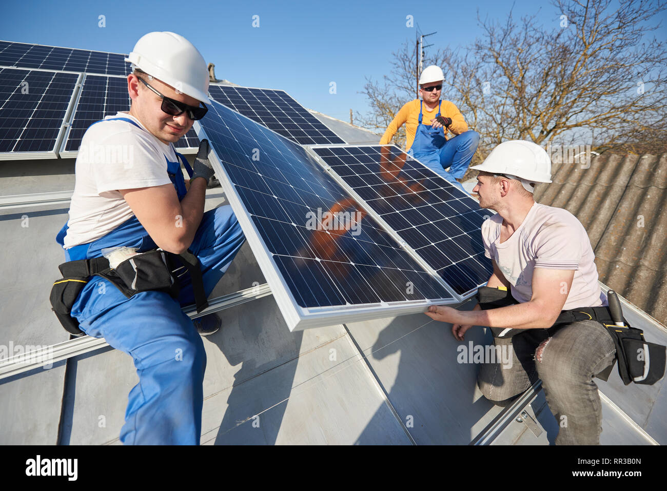 Worker installing lifting system hi-res stock photography and images ...