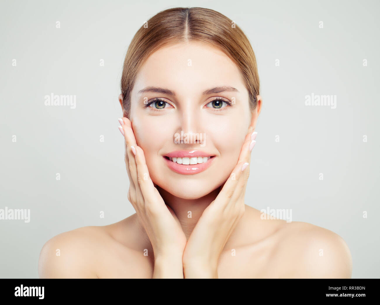 Attractive woman on white. Beautiful female model face Stock Photo - Alamy