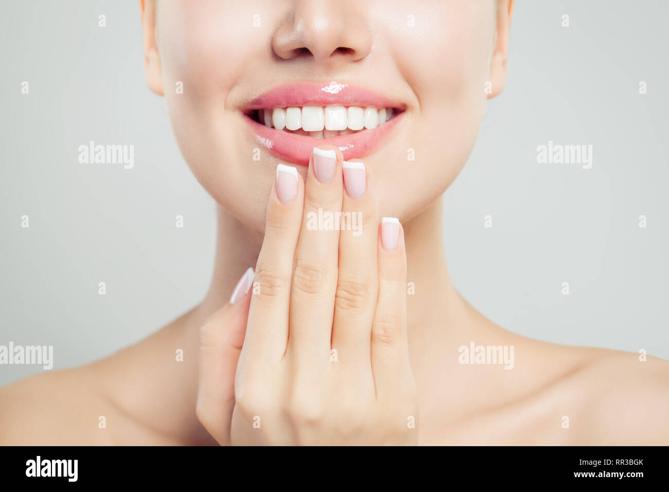 Natural beauty concept. Closeup female smile with natural pink lips and ...