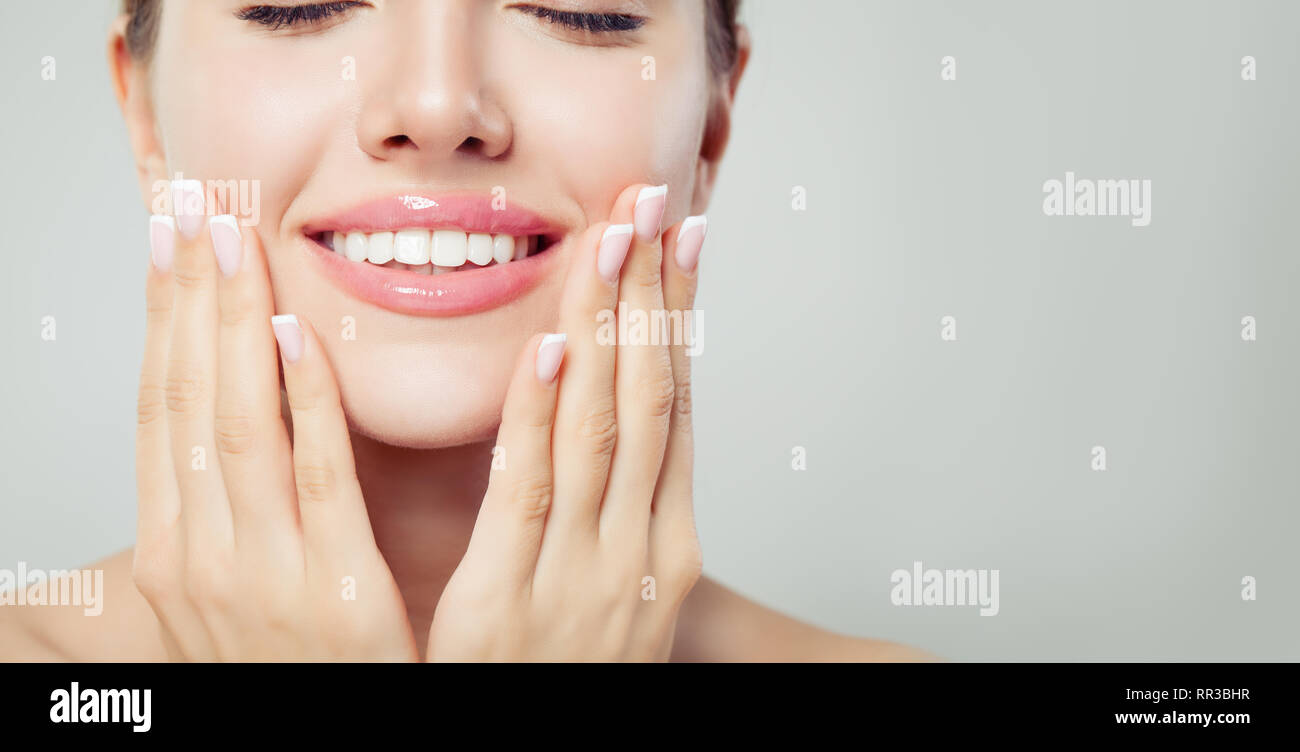 Perfect woman smile and manicured hand. French manicure and pink ...