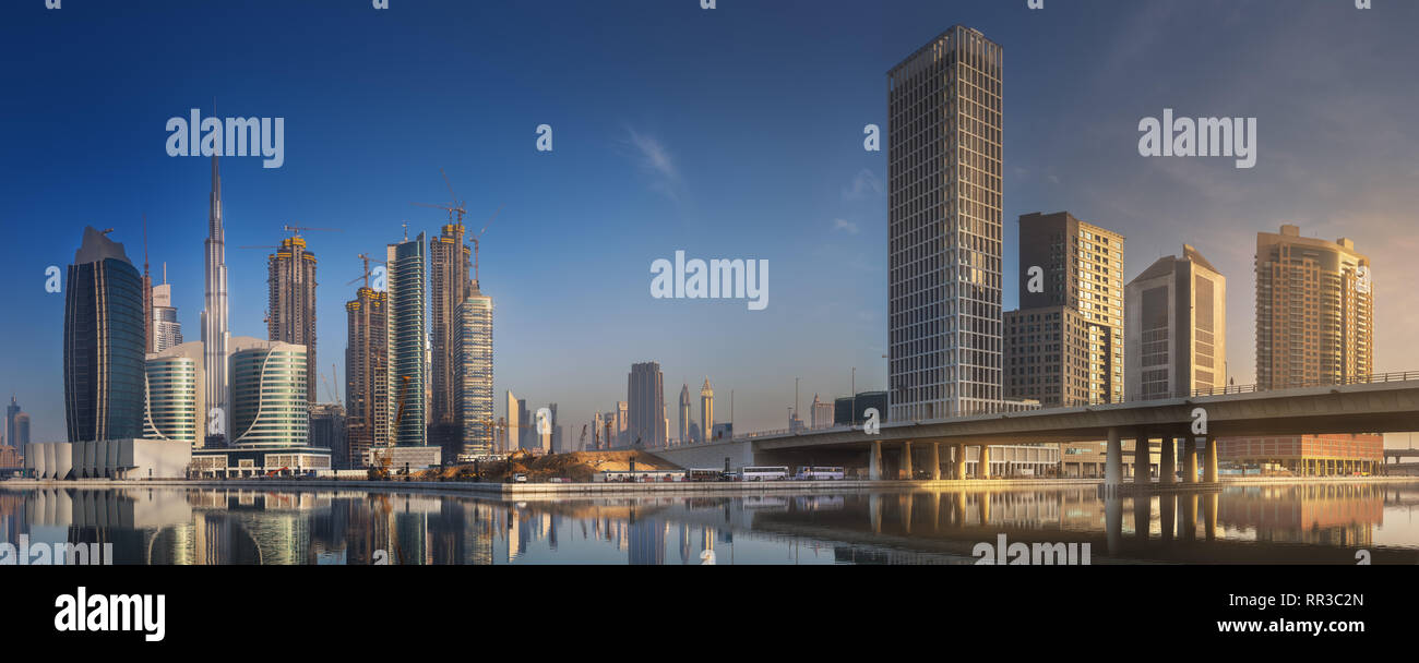 Cityscape of Dubai and panoramic view of Business bay with reflection ...