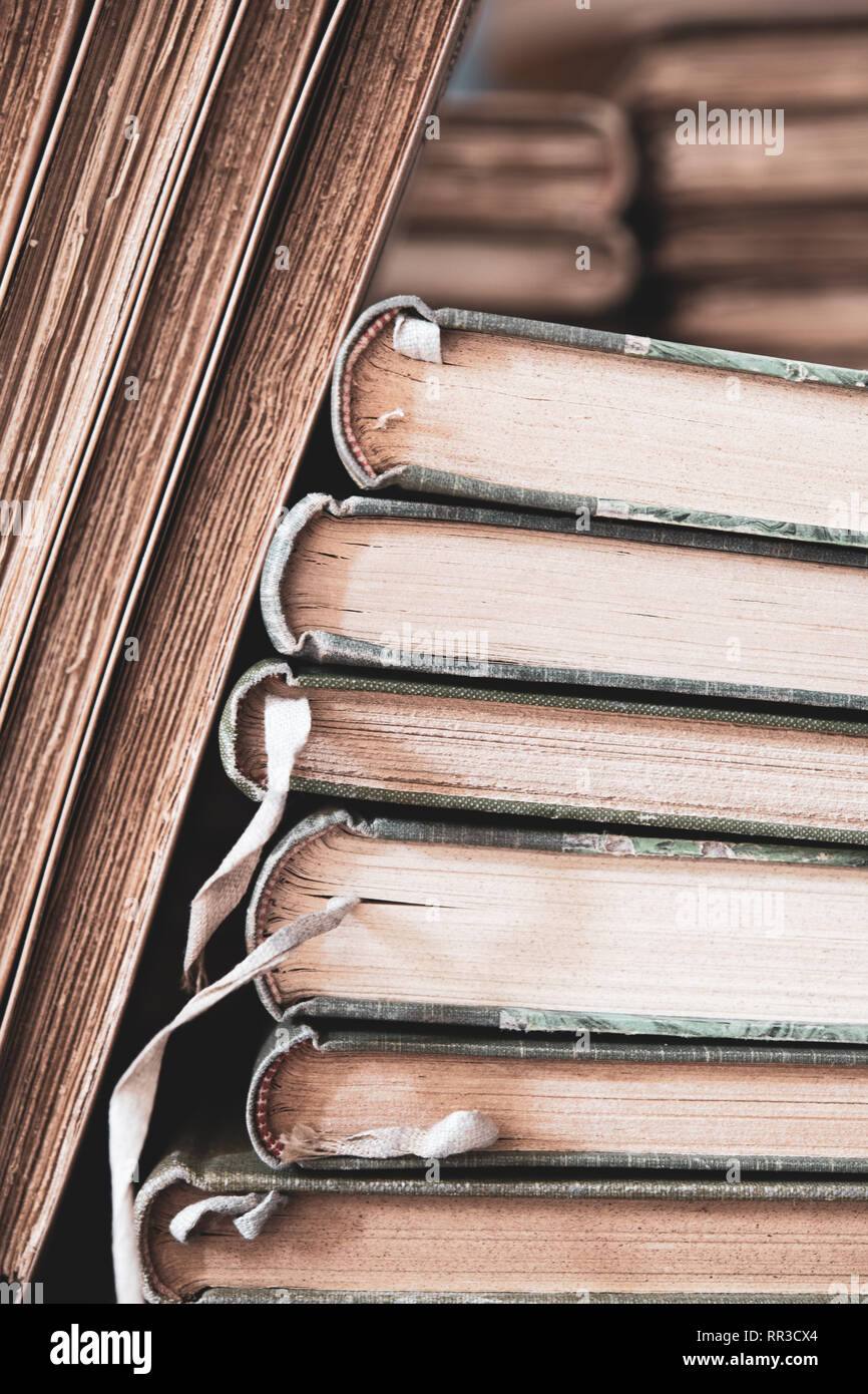 Close up side view of closed old books stack on library shelf Stock ...