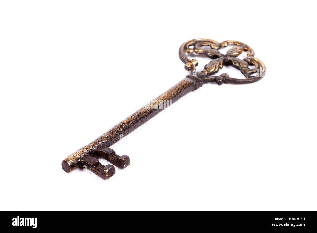 Antique key isolated on white background - photograph Stock Photo - Alamy