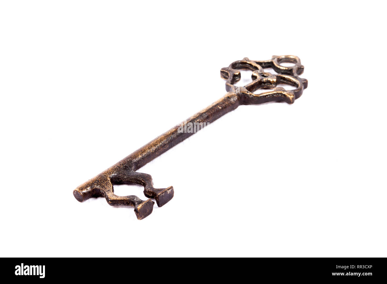 Antique key isolated on white background - photograph Stock Photo - Alamy