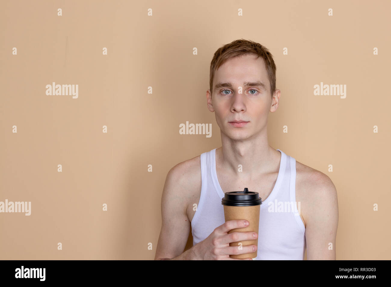 Guy drink from coffee or tea cup Stock Photo - Alamy