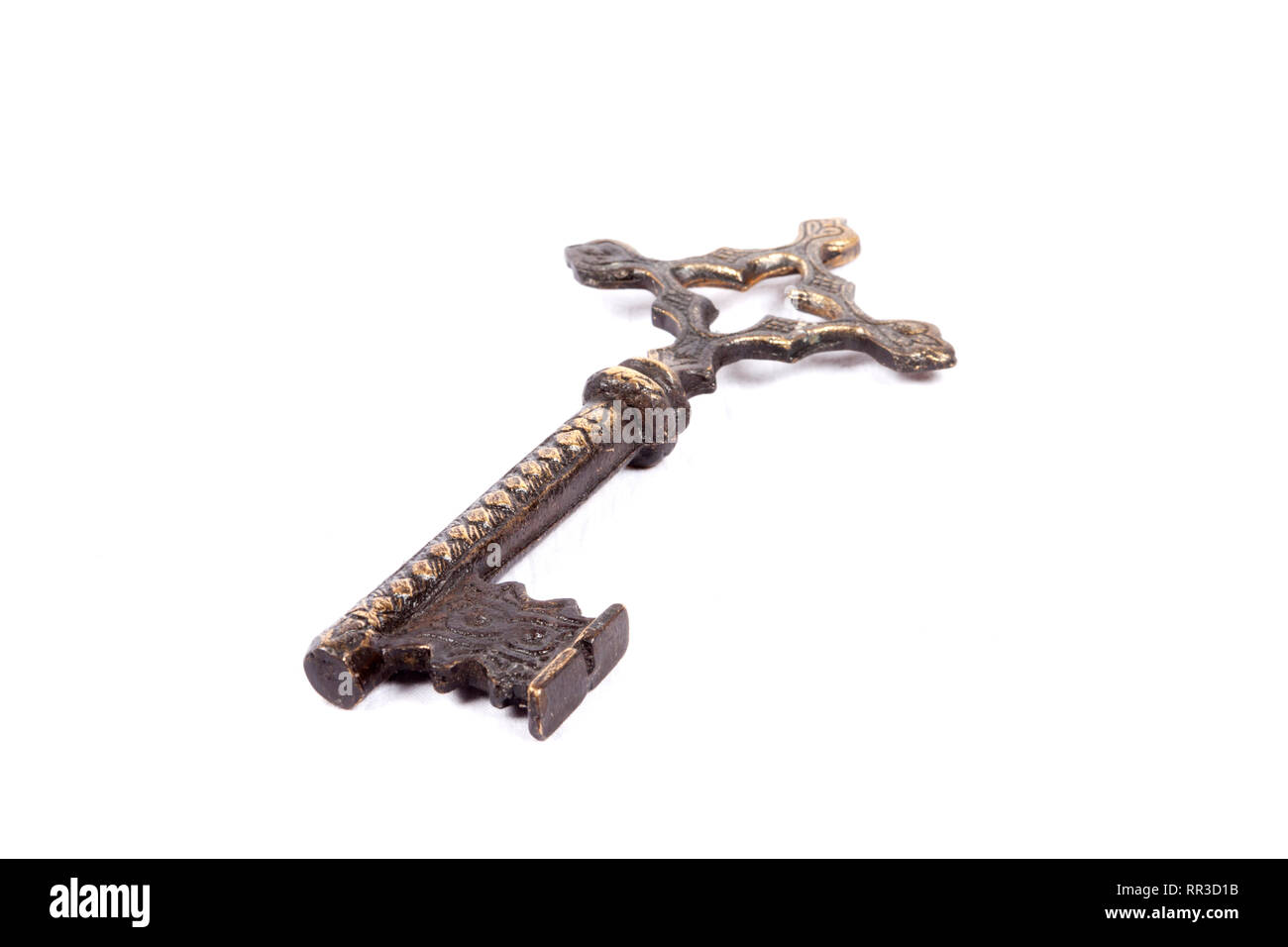 Antique key isolated on white background - photograph Stock Photo - Alamy