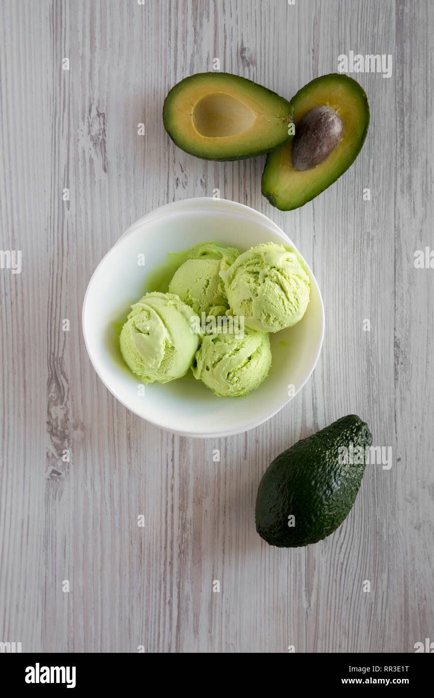 Homemade tasty avocado ice cream in a bowl, overhead view. Top view ...