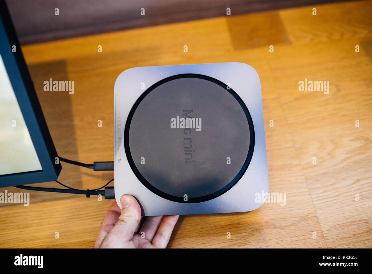 PARIS, FRANCE - NOV 7, 2018: Man holding the rear part of the new Apple ...