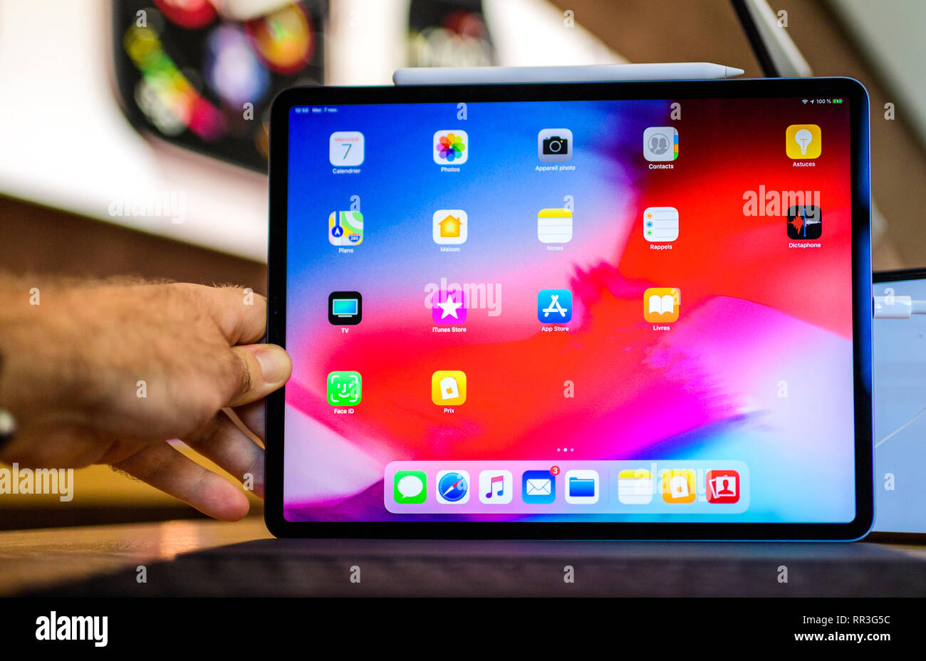 PARIS, FRANCE - NOV 7, 2018: Customer holding new Apple iPad Pro with ...