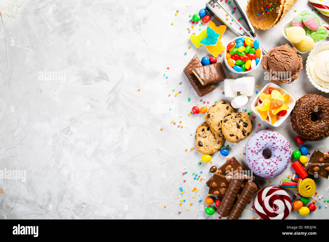 Selection of colorful sweets - chocolate, donuts, cookies, lollipops ...