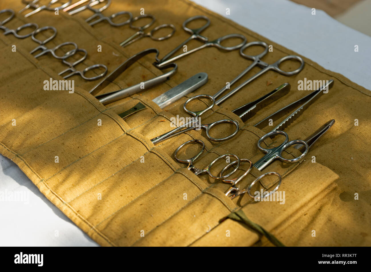 Set of nineteen-century military surgical instruments and tools lay on ...