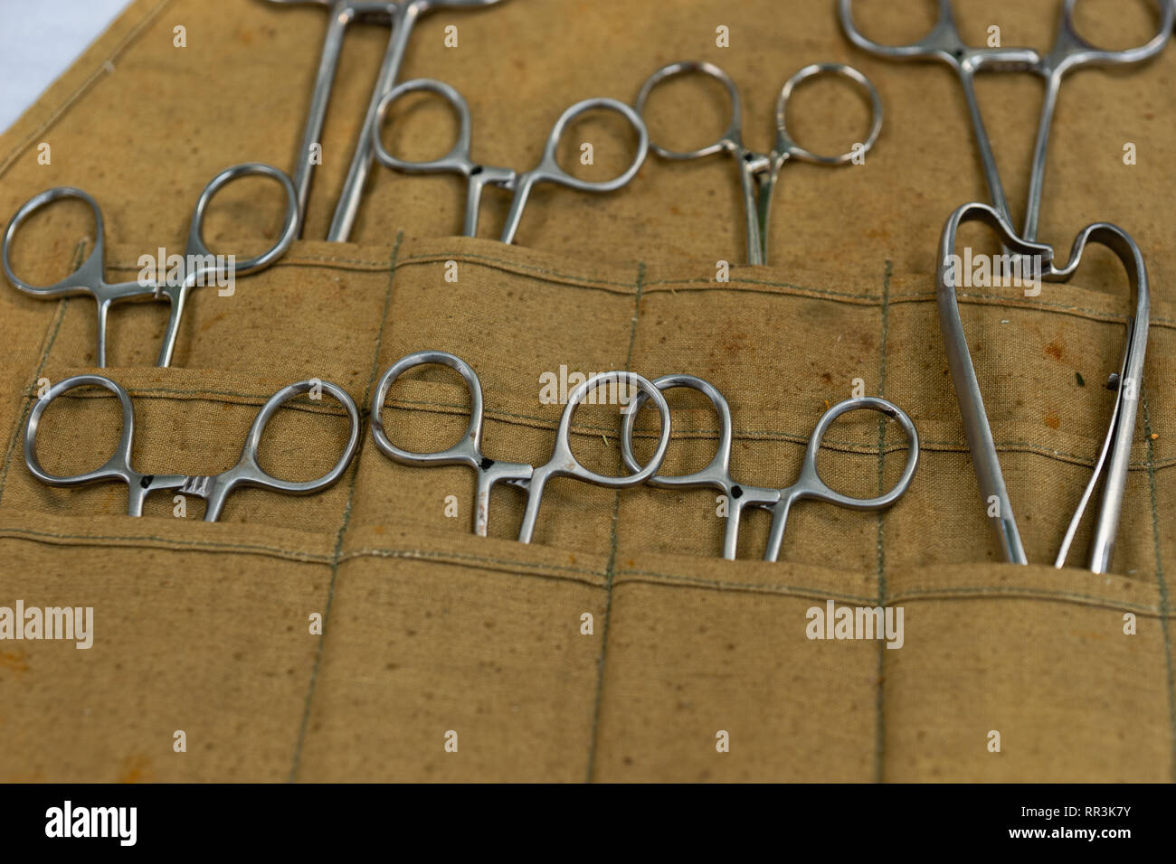 Set of nineteen-century military surgical instruments and tools lay on ...