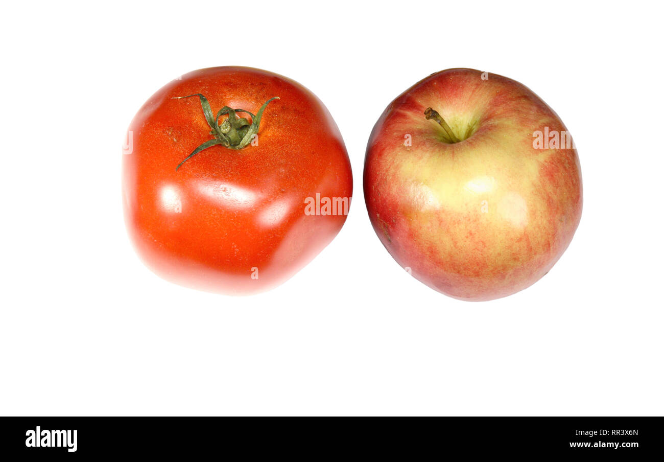 red tomato and apple on white background Stock Photo - Alamy