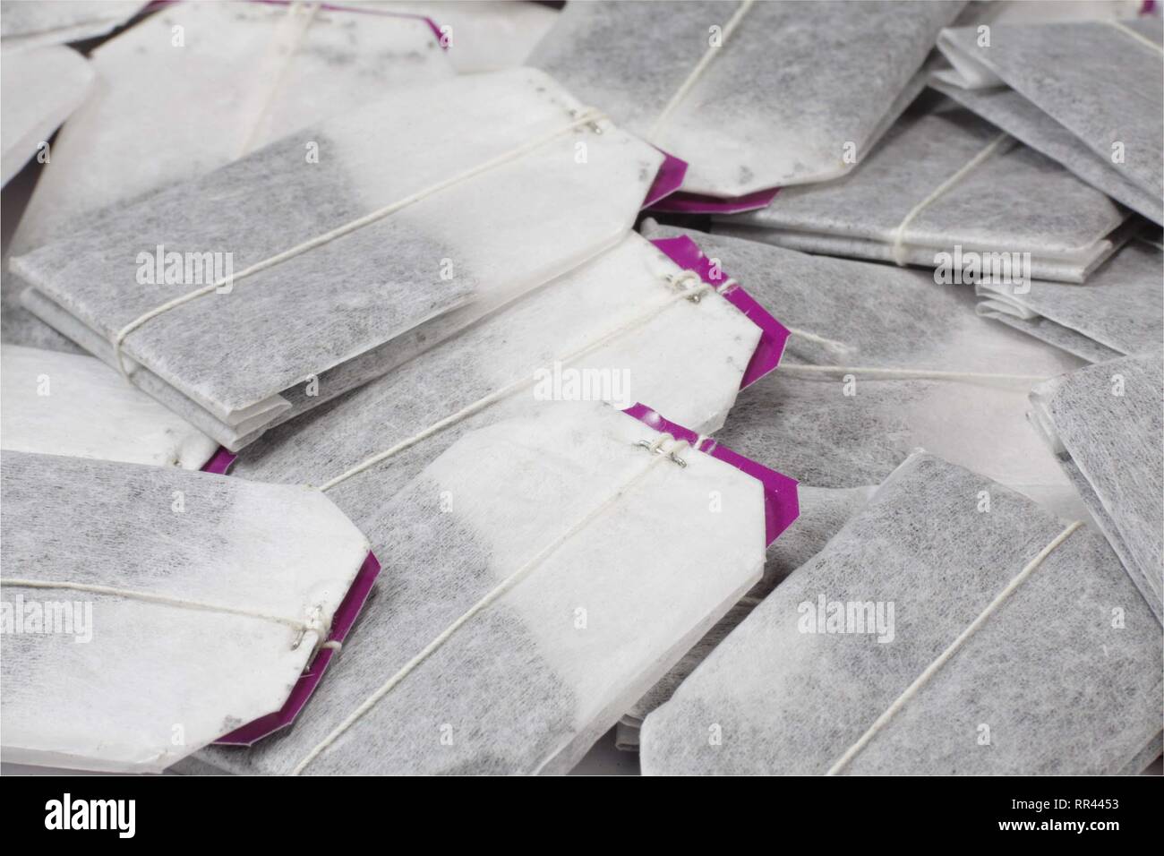 packets of black tea with red tags Stock Photo - Alamy