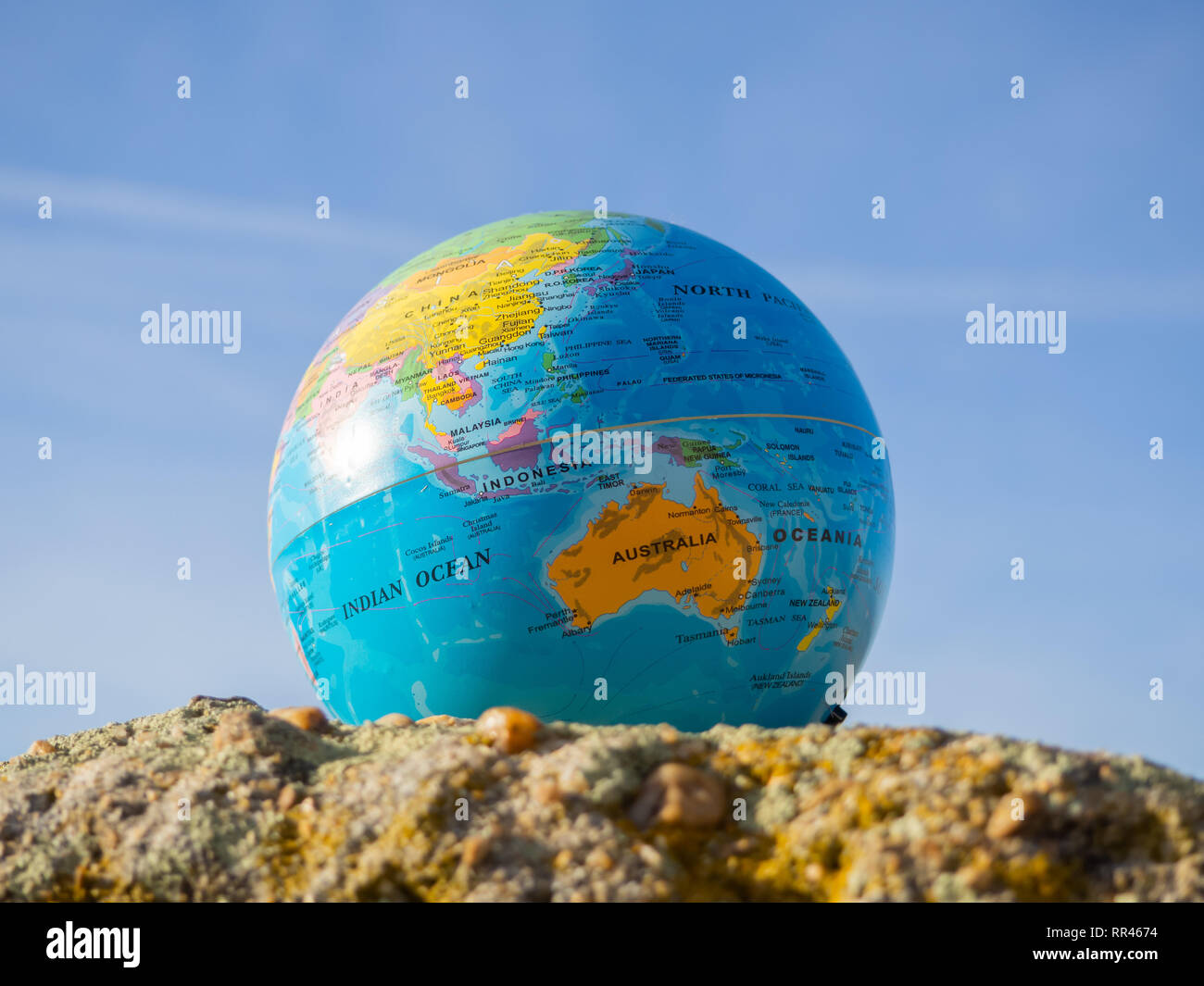 A terrestrial globe or planet Earth in one rock. Ecology concept Stock ...