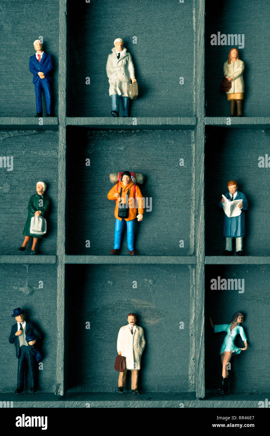 miniature figurines in a box with compartments, concept for ...