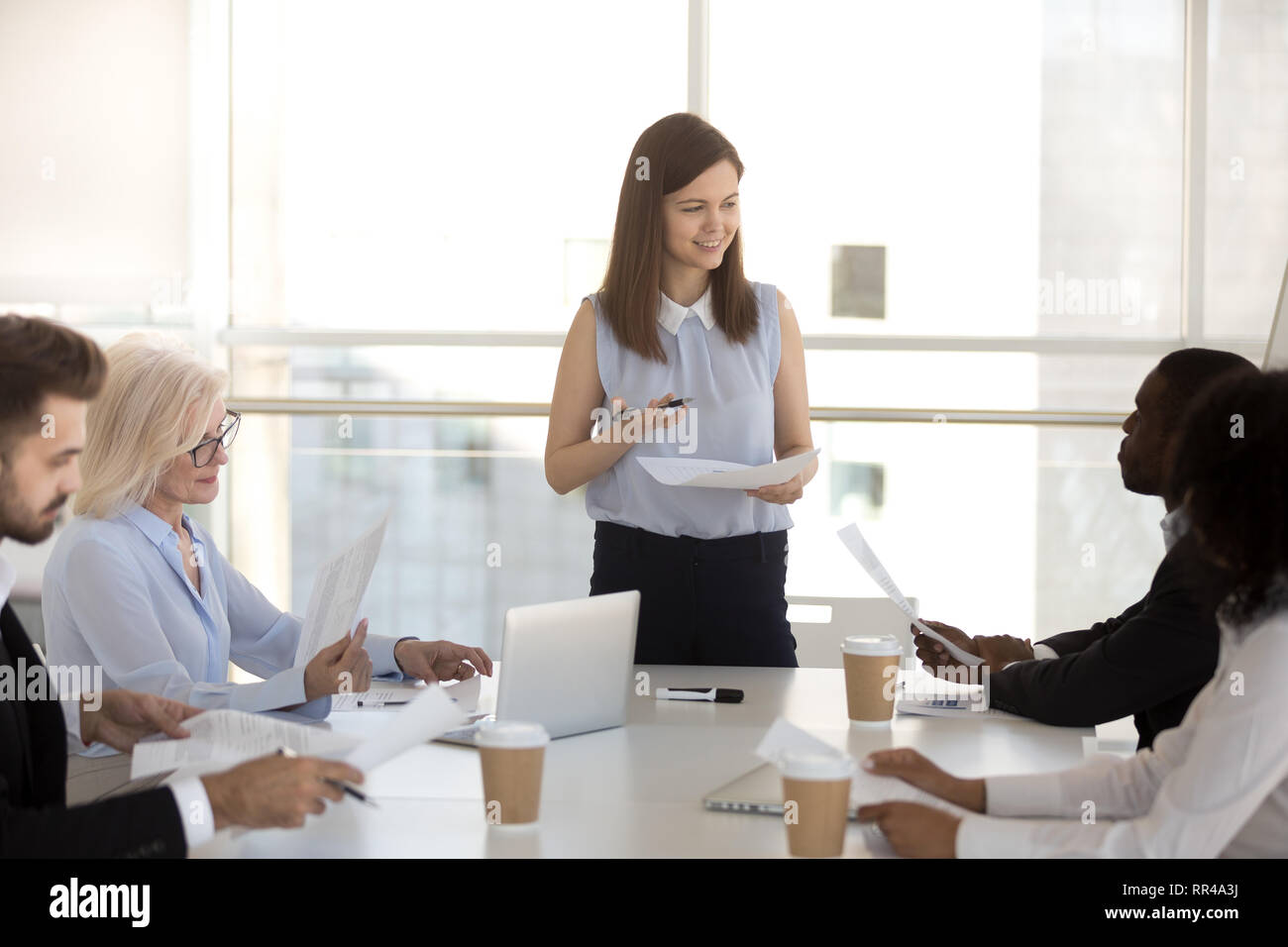 Multi-ethnic business people sitting on the briefing Stock Photo - Alamy