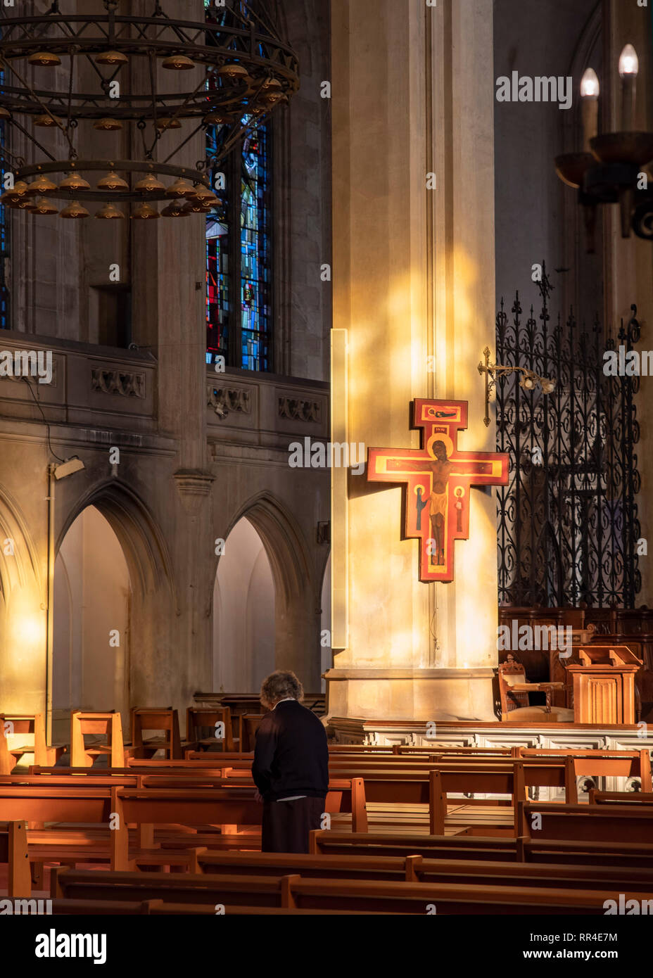 Woman inside a church in Arras Stock Photo - Alamy