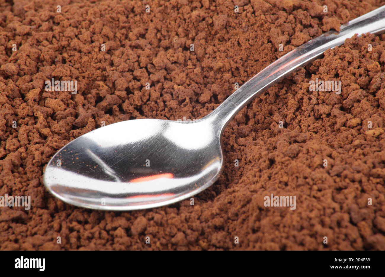 many of milled coffee and teaspoon Stock Photo - Alamy