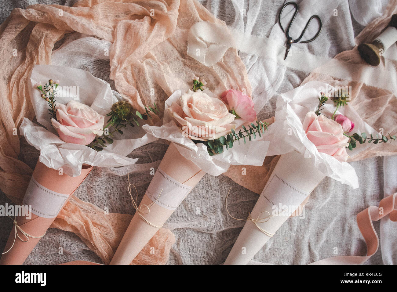 Flowers bouquets in paper cones Stock Photo - Alamy