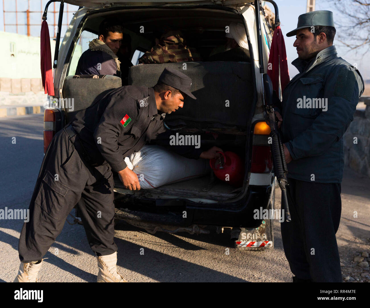 Herat, Afghanistan. 24th Feb, 2019. An Afghan policeman (L, front ...