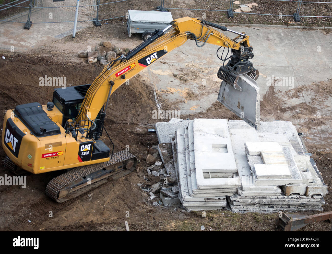 Schwerin, Germany. 19th Feb, 2019. An excavator is used to sort the ...