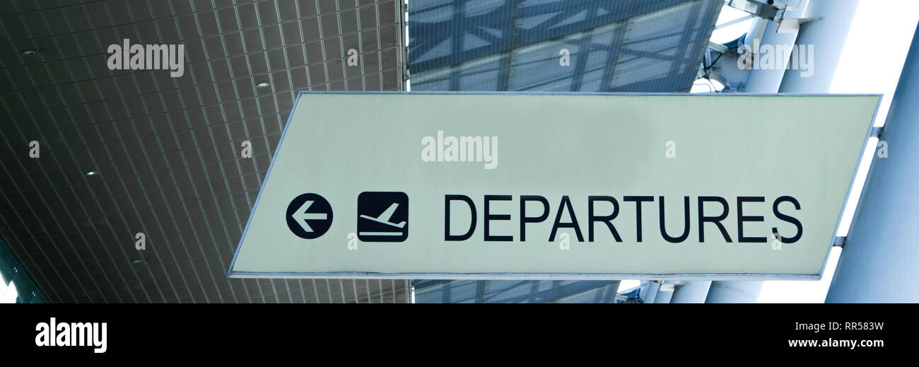 Airport departure sign. Directional sign in abstract modern airport ...