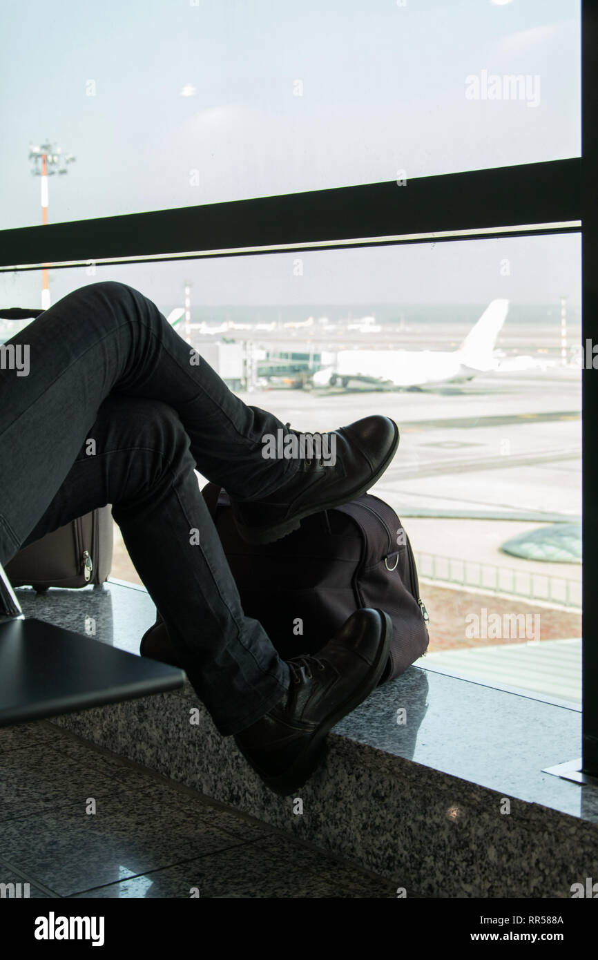 Crop view of man waiting on the airport and watching airplanes Stock ...