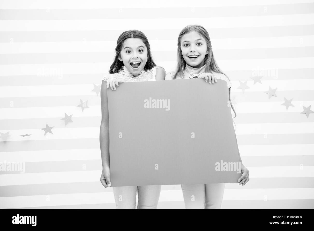 Amazing surprising news. Girl hold announcement banner. Girls kids ...