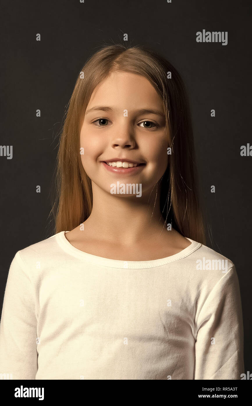Beauty, look, hairstyle. Kid model smiling with long healthy hair ...